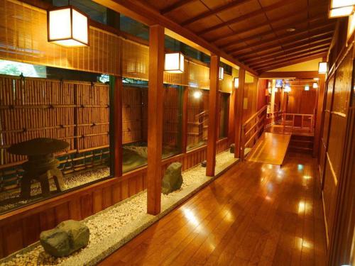 Watch the clear stream of Shima River from the giant open-air bath at ...