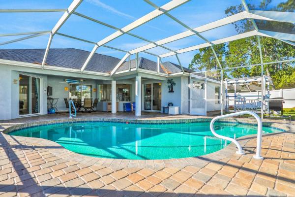 Contemporary Coastal Escape With Heated Pool, Fenced Yard, & Outdoor Dining - Flagler Beach, FL