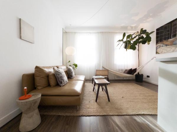 Tranquil Oasis W 100inch Cinema & Hammock, By The Design Traveller - City of London