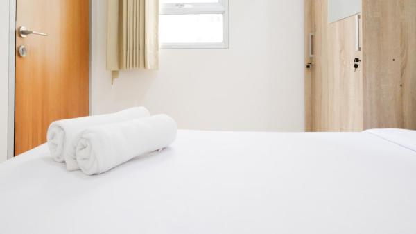 Homey 2br At Puncak Permai Apartment By Travelio - Surabaya