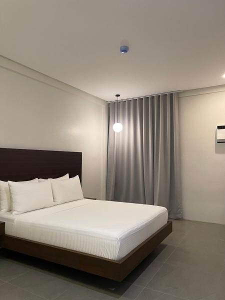 Joane Suites By Hotel Cara - Mataas Na Kahoy