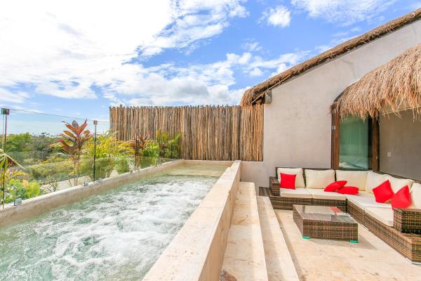 Eco-chic Design Condos Wrapped In Nature's Elements By Stella Rentals - Paradise Beach