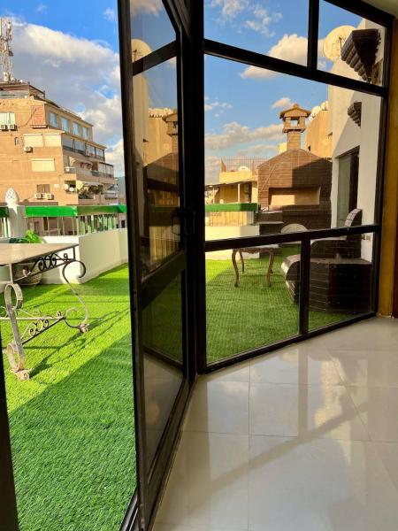المهندسين شقة فندقية فاخرة باطلالة علي روف خاص خمسة غرف كاملة - Giza